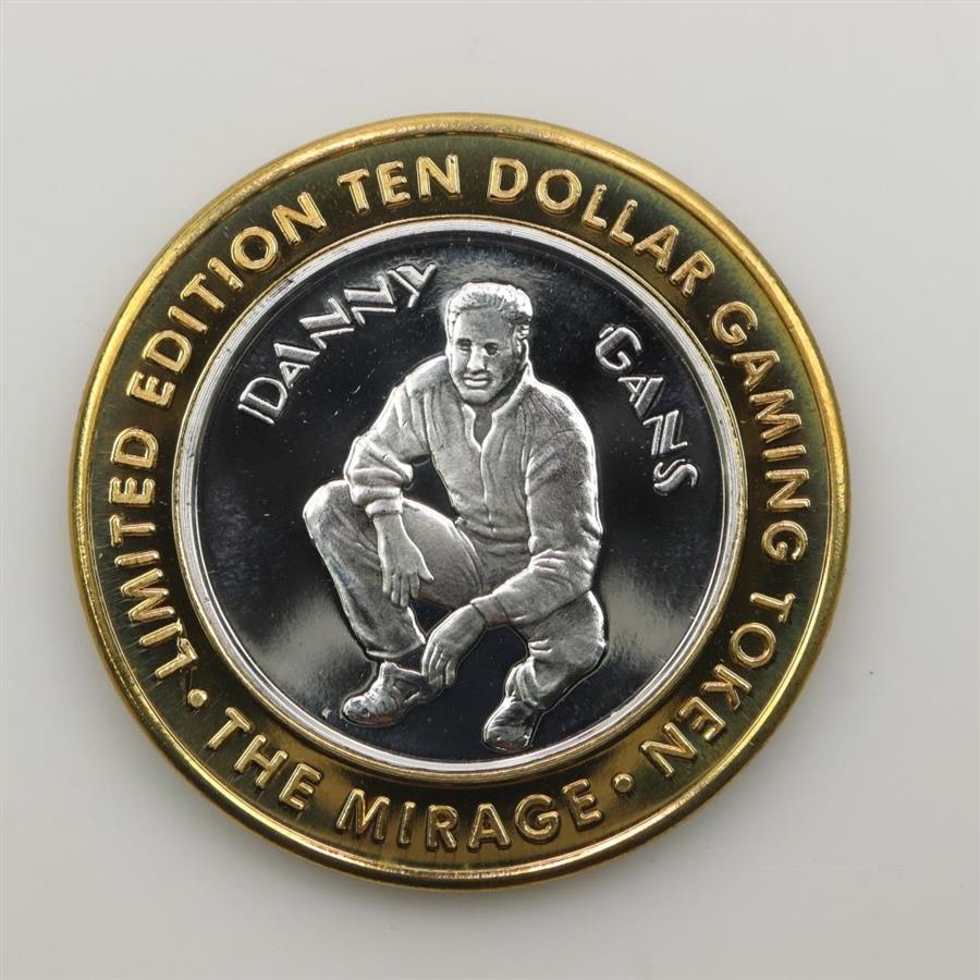 .999 Silver And Brass Danny Gans Gaming Token | Property Room
