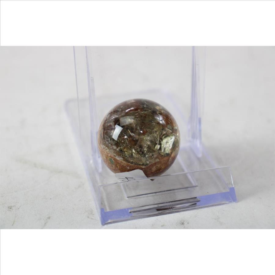 Polished Sphere Stone With Visible Silver Pieces Inside | Property Room