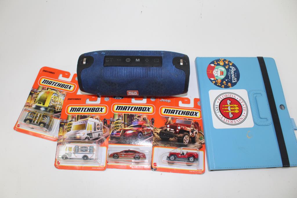 4 Matchbox Toy Cars, T&g Bluetooth Speaker And Unknown Ipad Cover ...