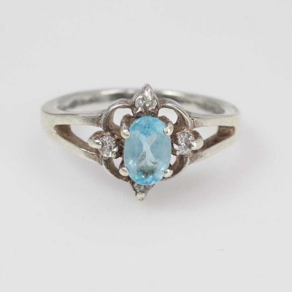 2.56g Silver Ring With Clear And Light Blue Stones | Property Room