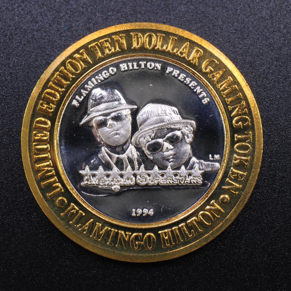 .999 Silver And Brass Flamingo Hilton Gaming Token | Property Room