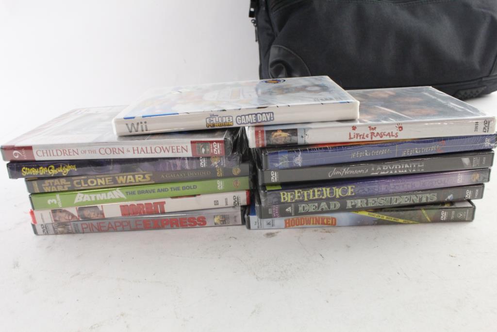 Assorted DVD Movies And Wii Game In Travel Case, 13 Pieces | Property Room