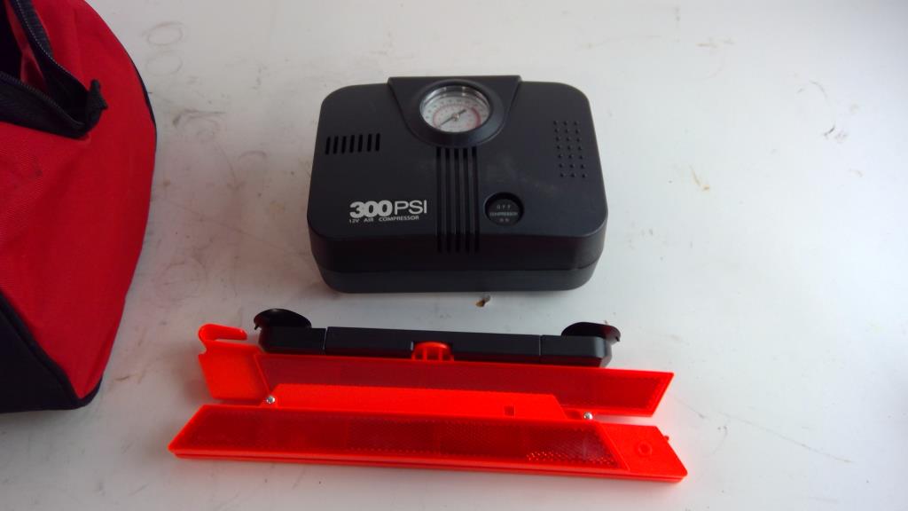 Bridgestone Bag With Unbranded Air Compressor And Triangles | Property Room