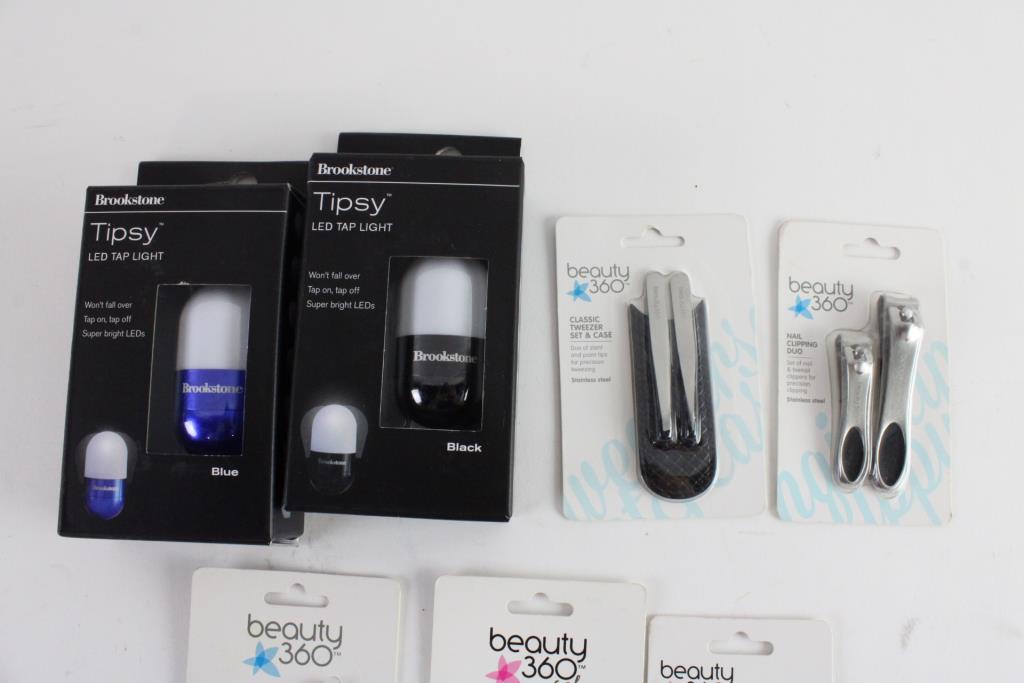 Brookstone Tipsy LED Tap Lights And More, 7 Pieces | Property Room