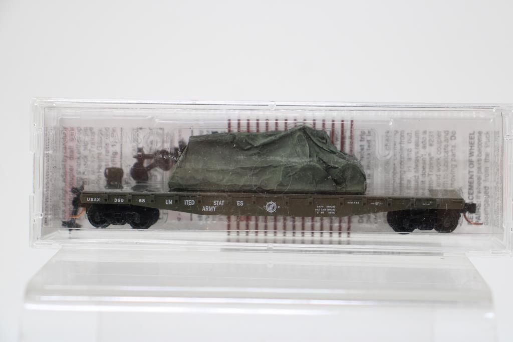 Micro-Trains Line 50' Flat Car Fishbelly Side W/ Cannon Load | Property Room