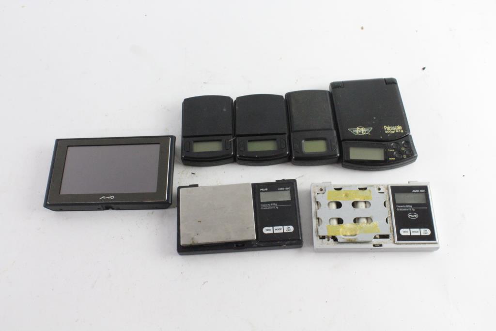 Mio GPS And Assorted Pocket Scales, 7 Pieces | Property Room