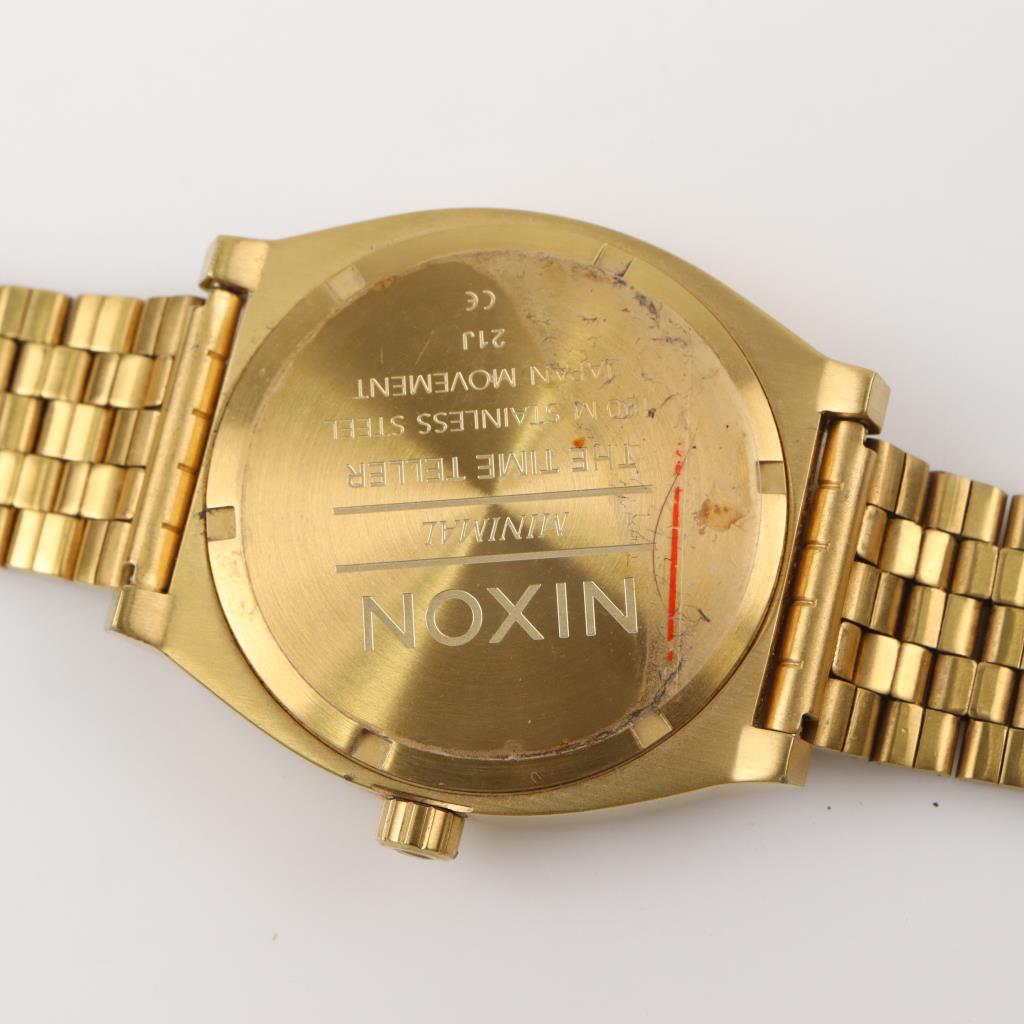 Nixon Time Teller Watch And Foreign Coins | Property Room