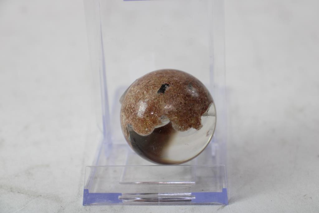 Polished Sphere Stone With Visible Silver Pieces Inside | Property Room