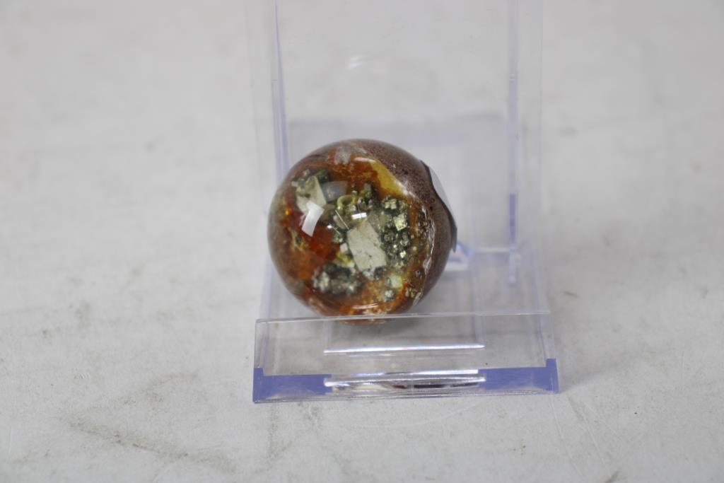 Polished Sphere Stone With Visible Silver Pieces Inside | Property Room