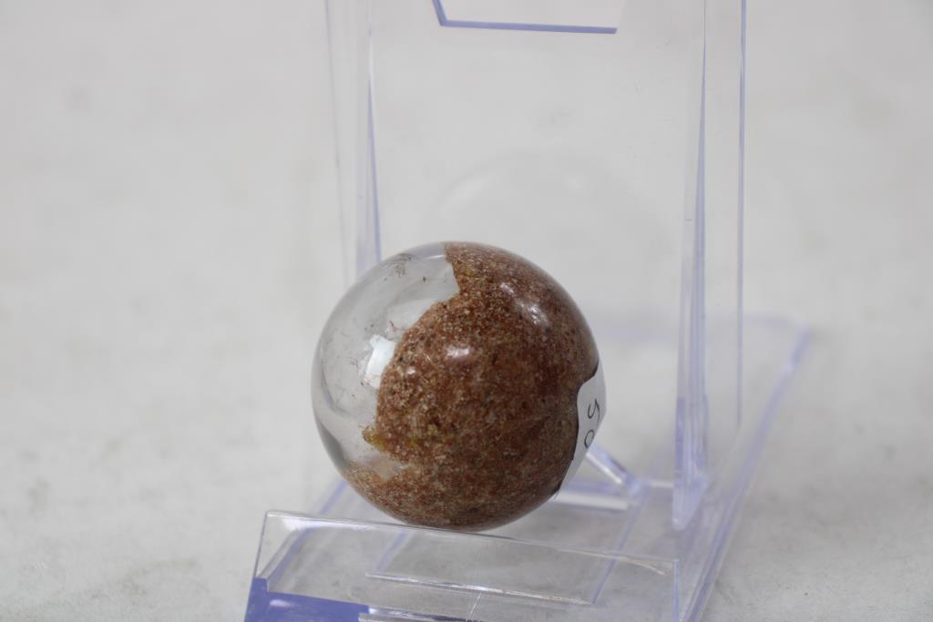 Polished Sphere Stone With Visible Silver Pieces Inside | Property Room