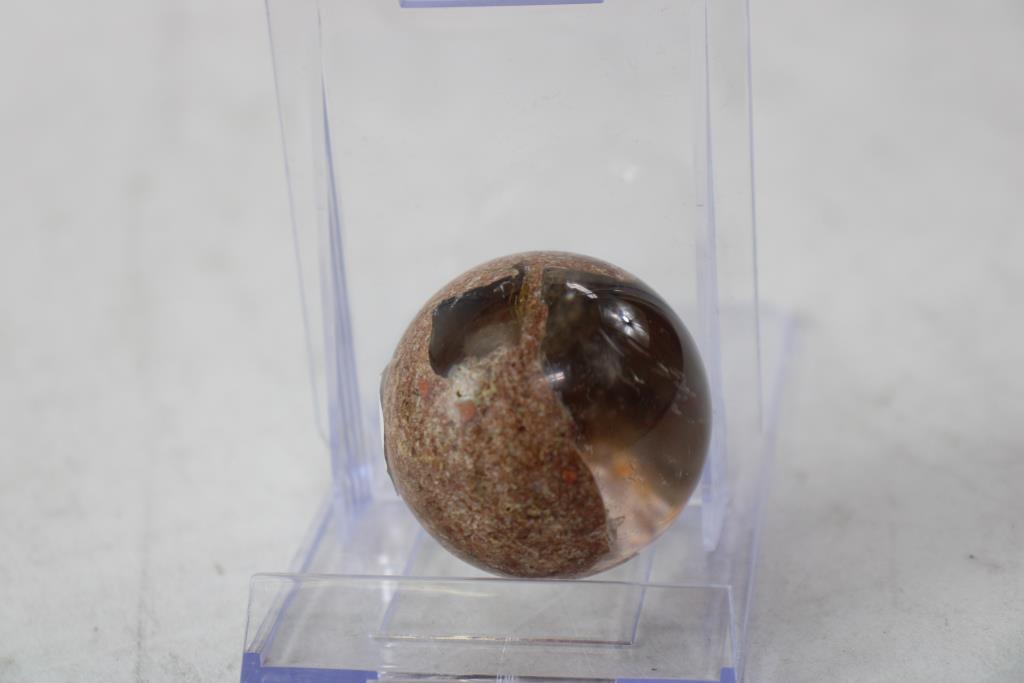 Polished Sphere Stone With Visible Silver Pieces Inside | Property Room