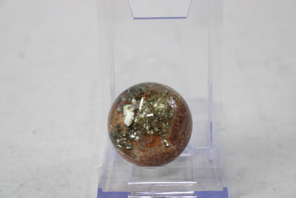 Polished Sphere Stone With Visible Silver Pieces Inside | Property Room