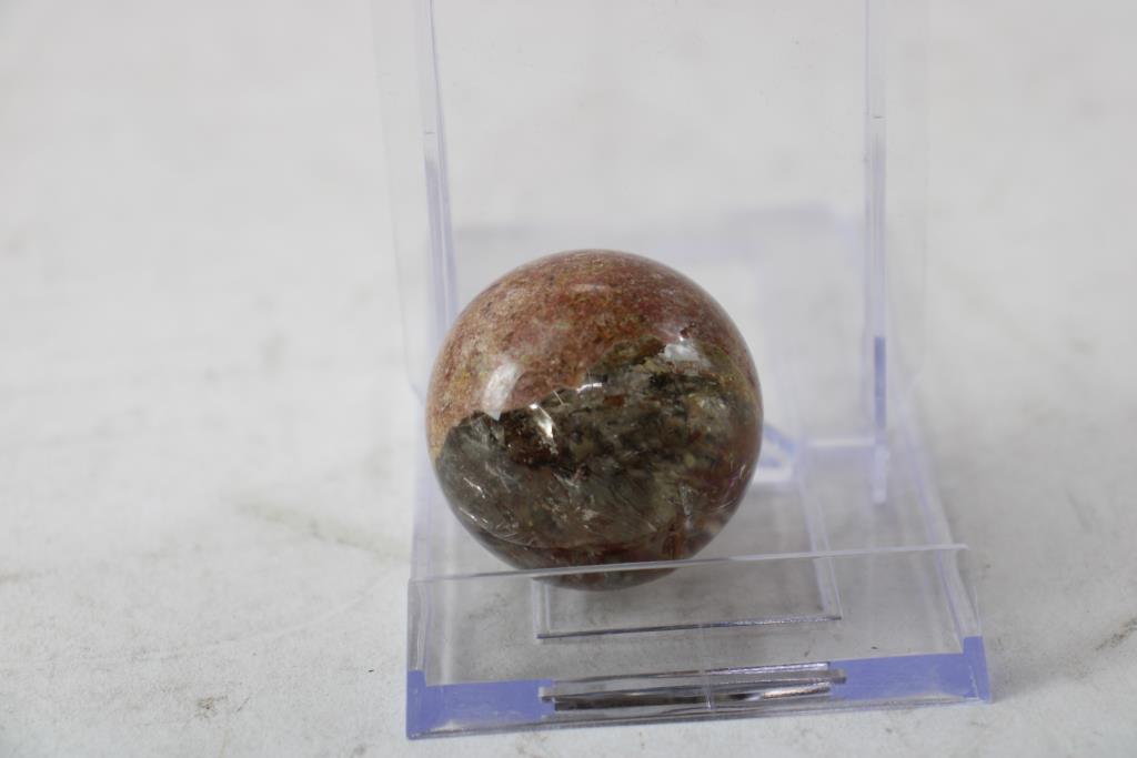 Polished Sphere Stone With Visible Silver Pieces Inside | Property Room
