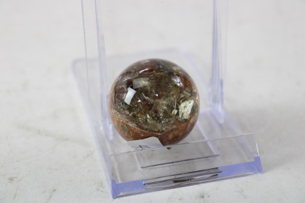 Polished Sphere Stone With Visible Silver Pieces Inside | Property Room