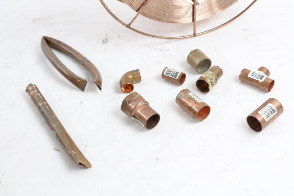 Spool Of Wire, Fittings And Old Pipes | Property Room