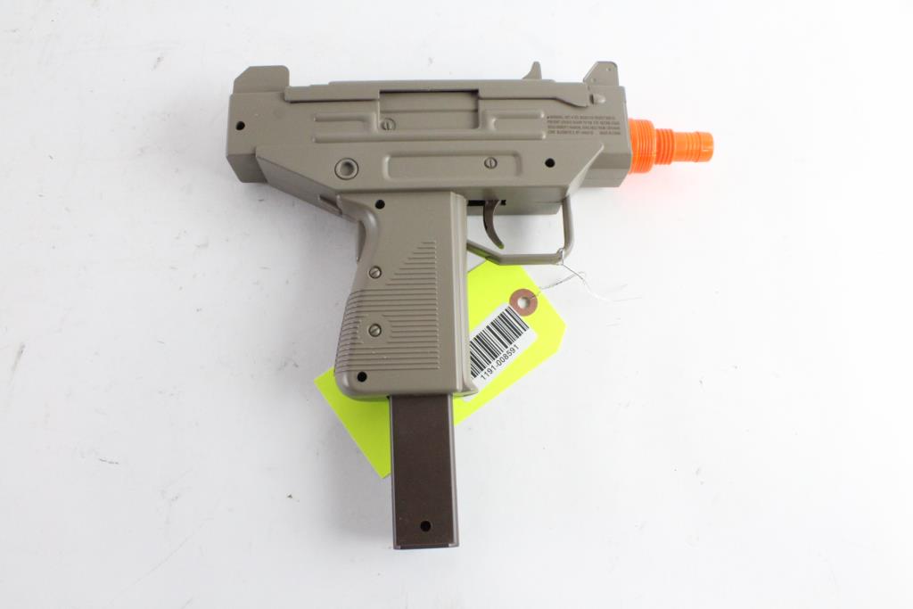 Tan Uzi Spring Airsoft Gun | Property Room