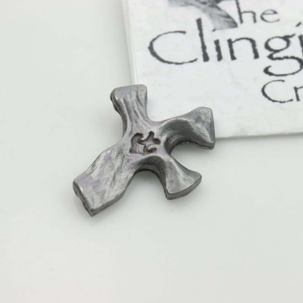 The Clinging Cross | Property Room