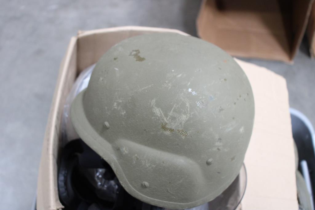 Tub With Used Military Helmets | Property Room
