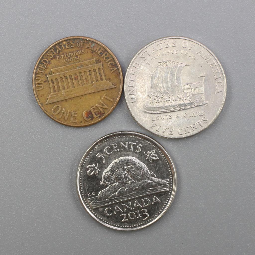 Two US Coins And A Canadian Coin | Property Room