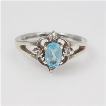 2.56g Silver Ring With Clear And Light Blue Stones | Property Room