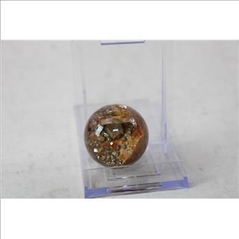 Polished Sphere Stone With Visible Silver Pieces Inside | Property Room
