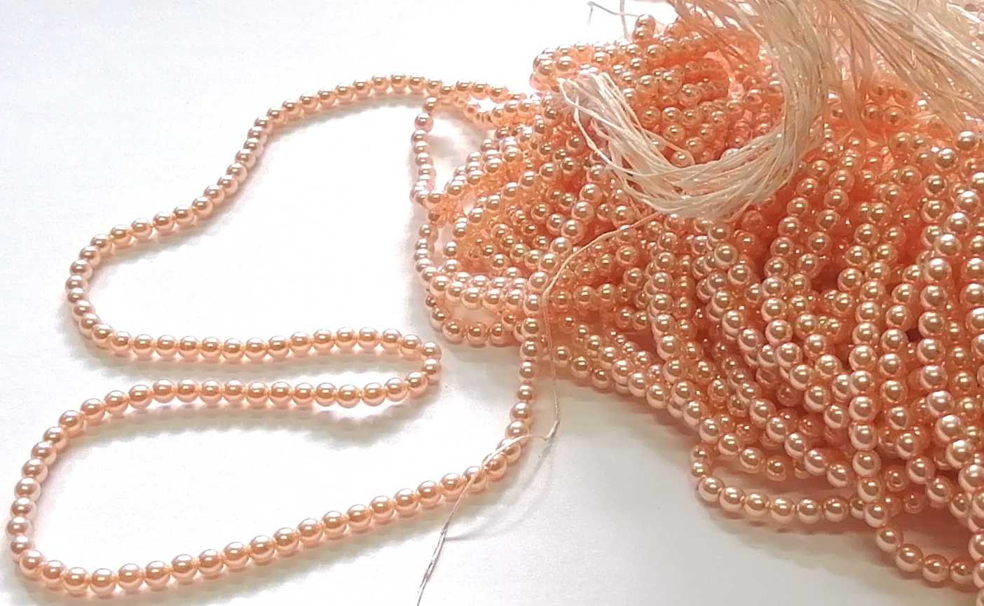 PEARLS - 4MM LIGHT PEACH GLASS BASE PEARLS - 5600 BEADS | Property Room