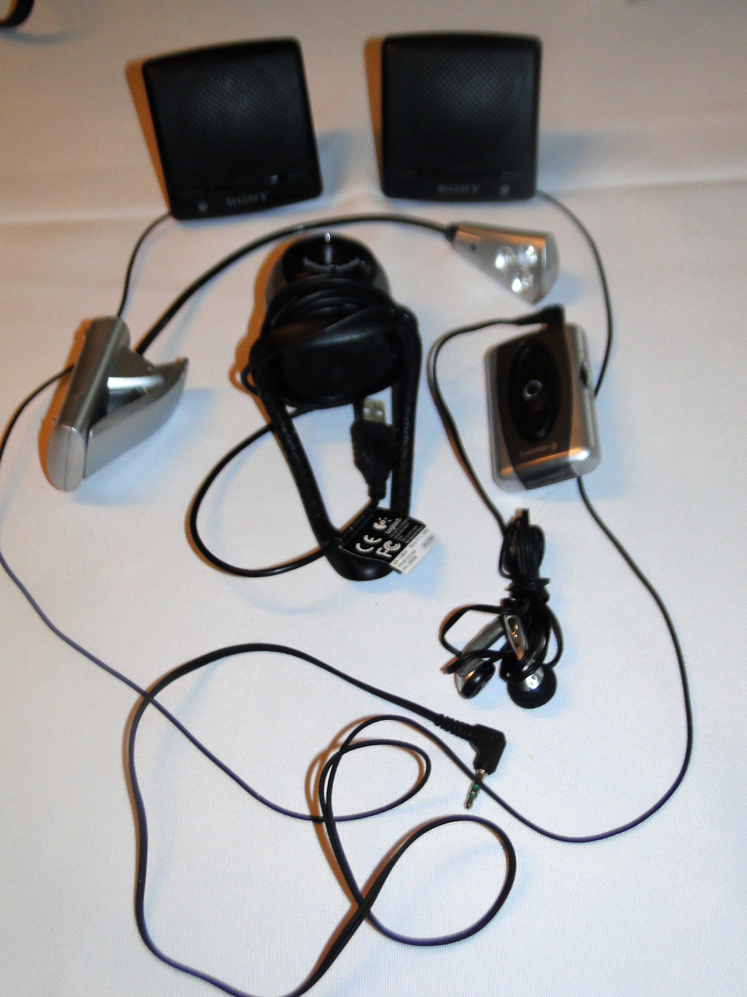Assorted Mixed Electronics including Hearing Aid Speakers | Property Room