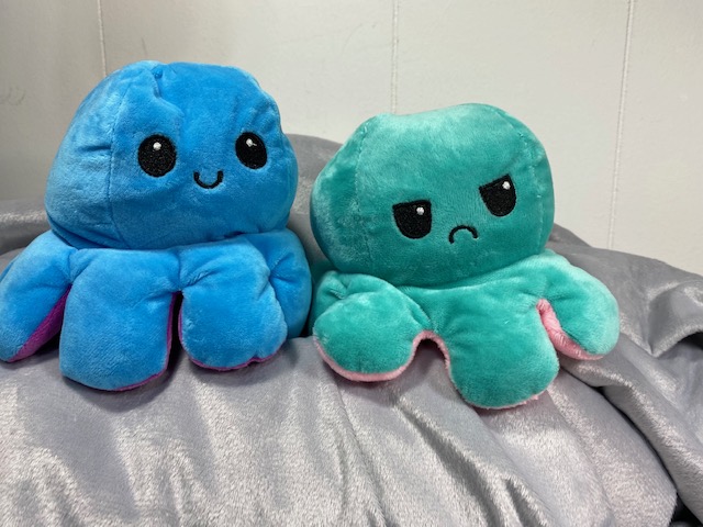 TWO REVERSIBLE OCTOPUS , SAD AND MAD | Property Room