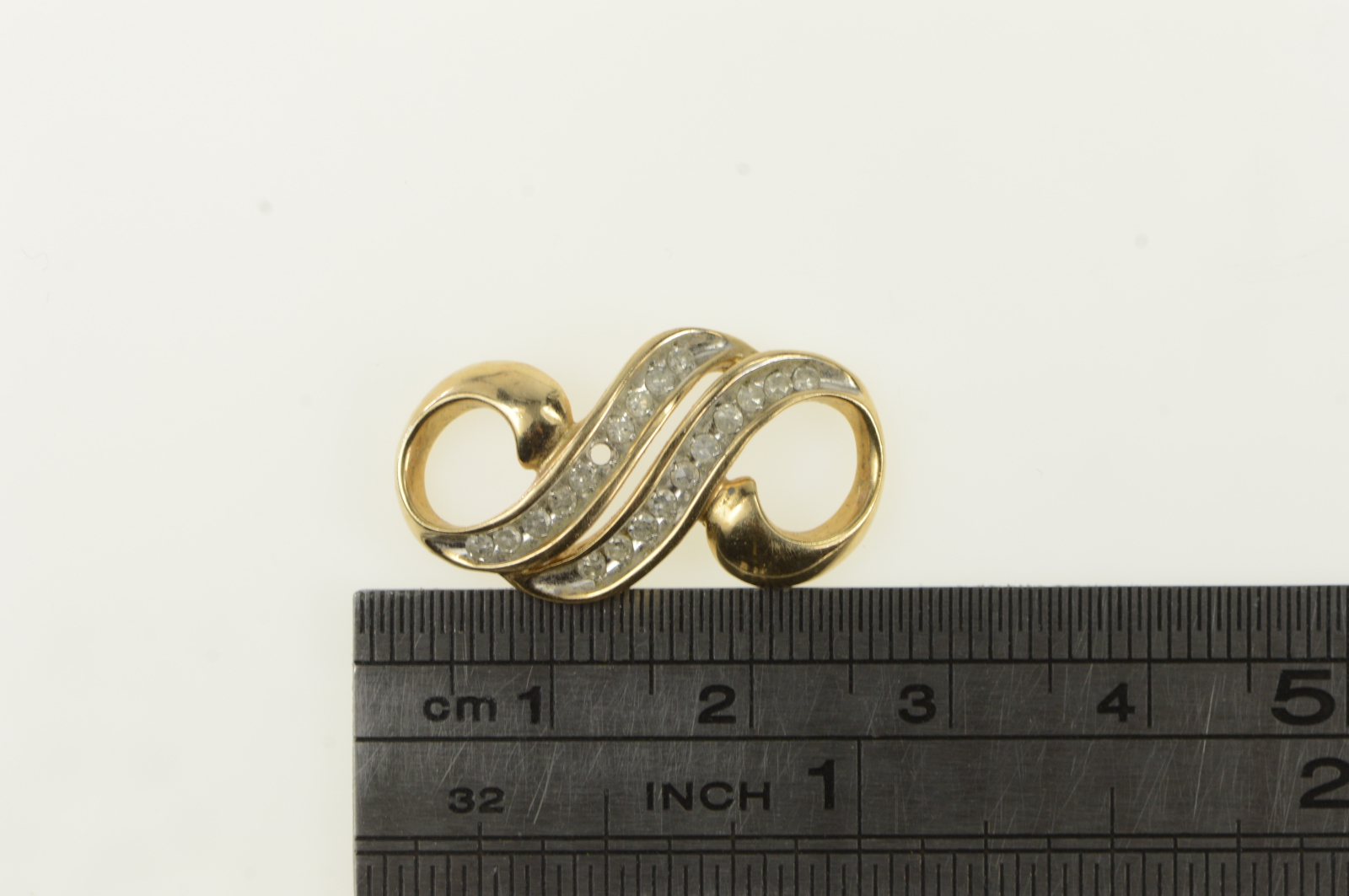 10K Diamond Encrusted Infinity Symbol Yellow Gold Pendant | Property Room