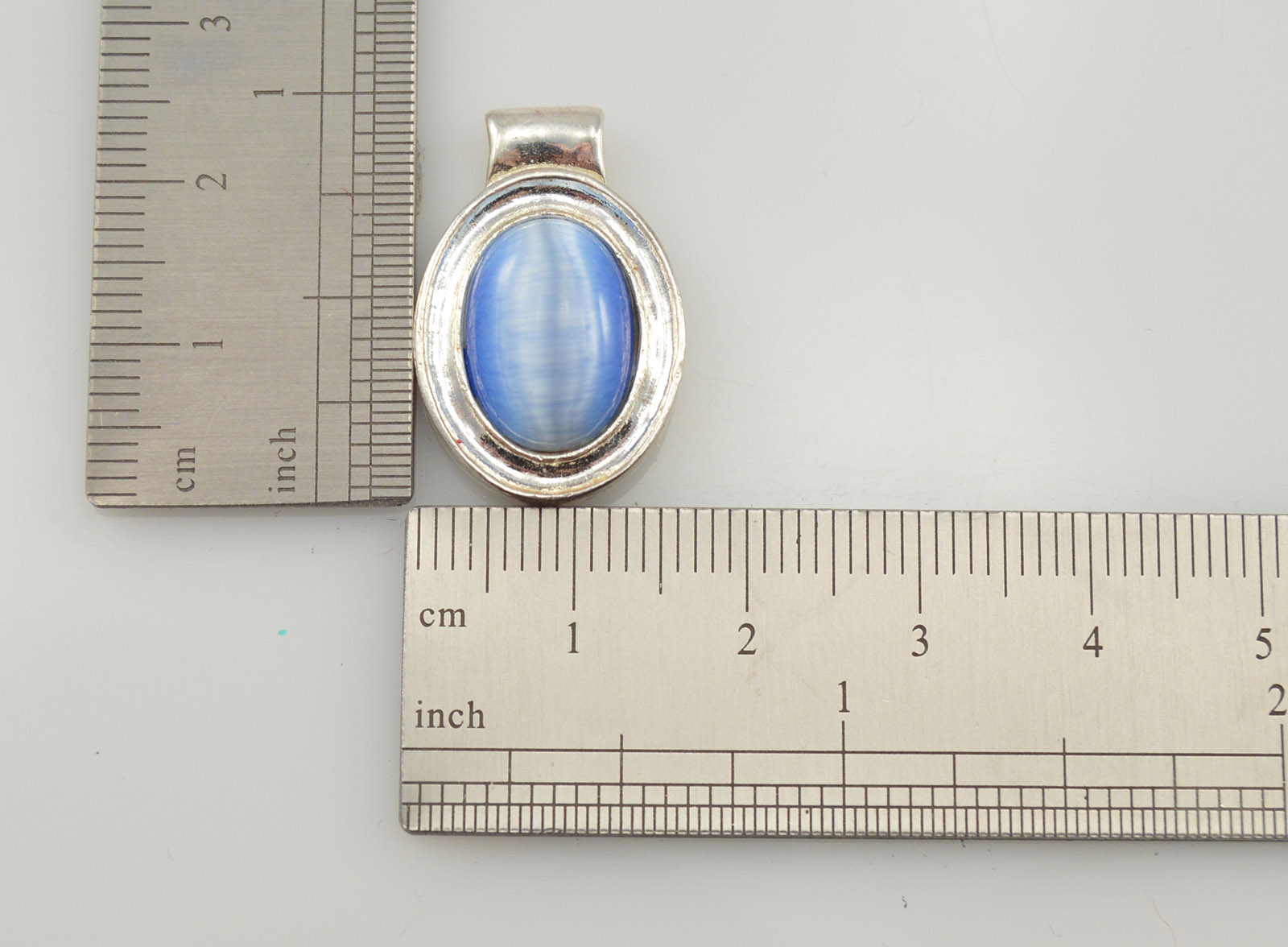 7.7g Bezel Set Iridescent Blue Stone Pendant | Property Room