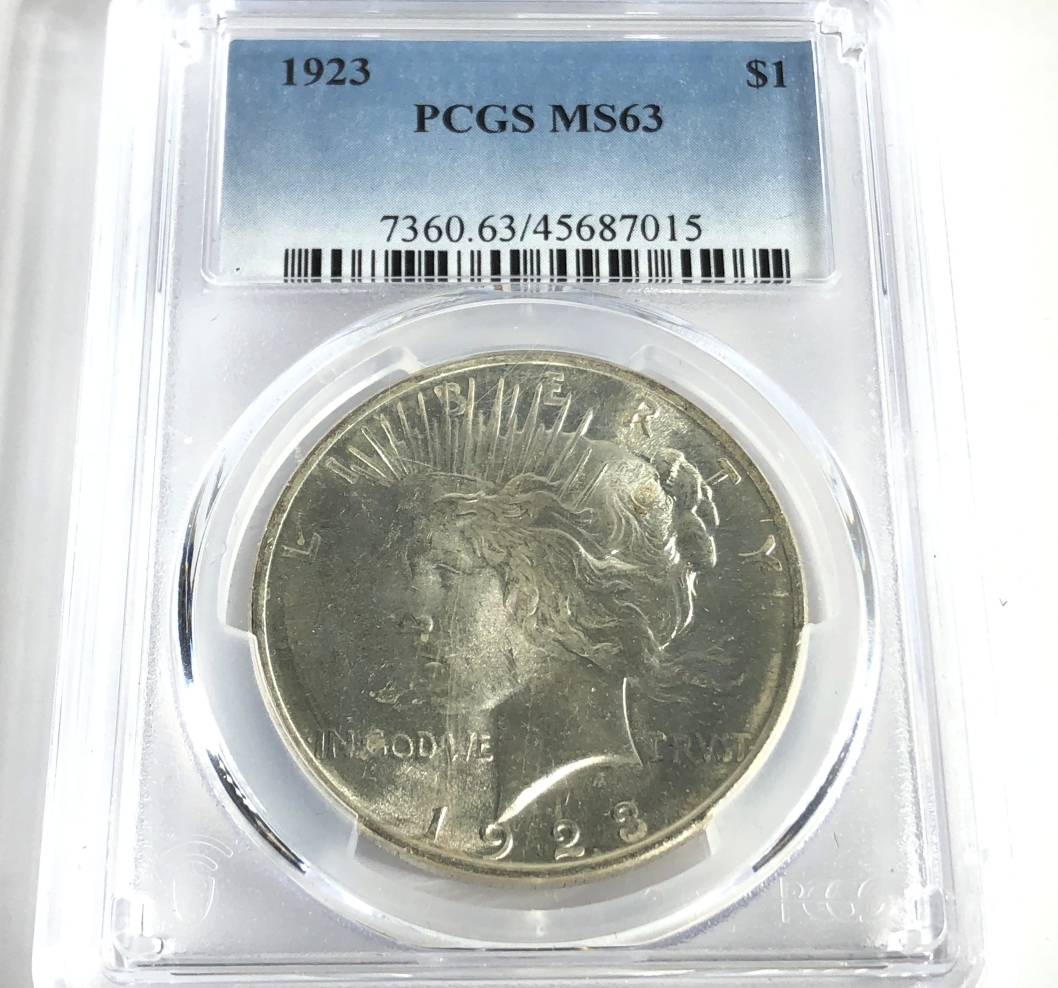 1923 Peace Silver Dollar*Graded MS63 by PCGS | Property Room