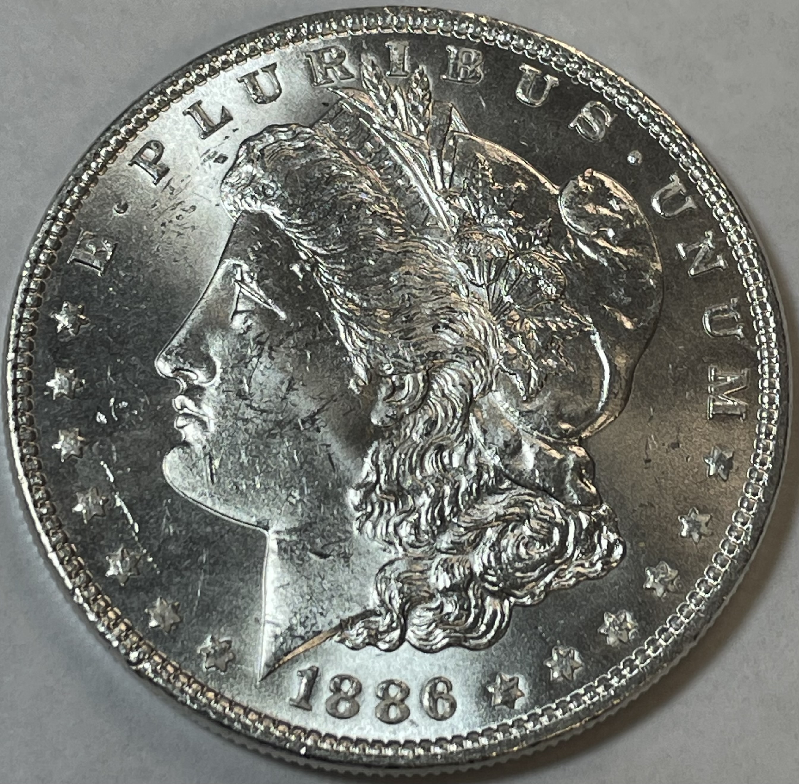 HIGH GRADE 1886 Morgan Silver Dollar - Brilliant Uncirculated | Property Room
