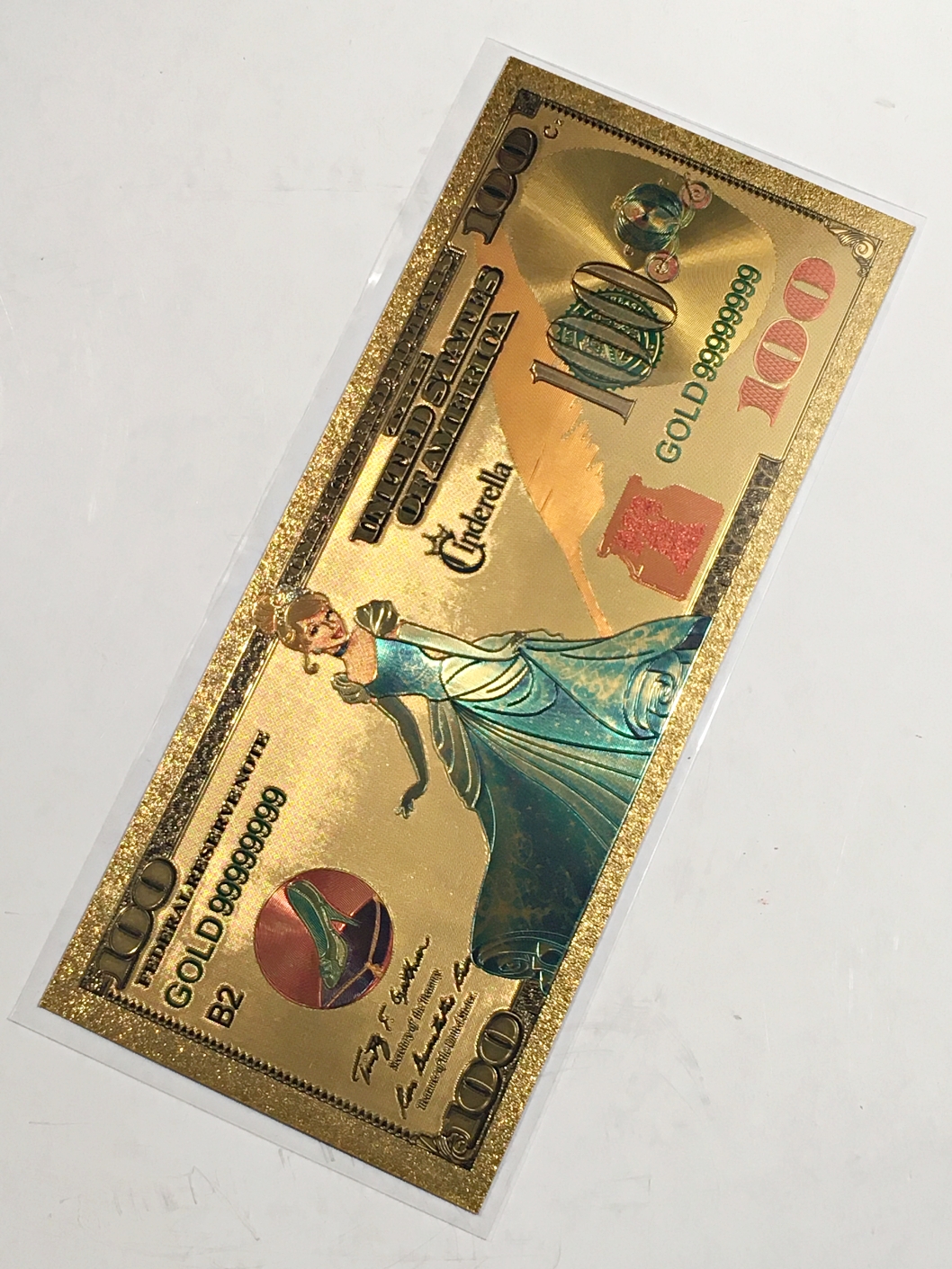 Disney Princesses/Cinderella Gold Foil 100 Dollar Banknote | Property Room