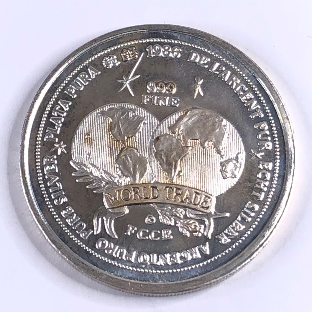 One Troy Ounce .999 Fine Silver Round*1986 World Trade Unit | Property Room