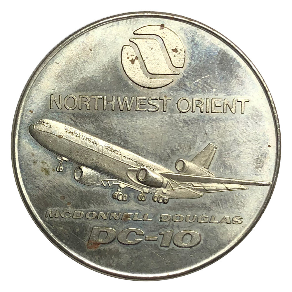 >Fly Northwest to Florida Token - DC-10 Airplane Token | Property Room
