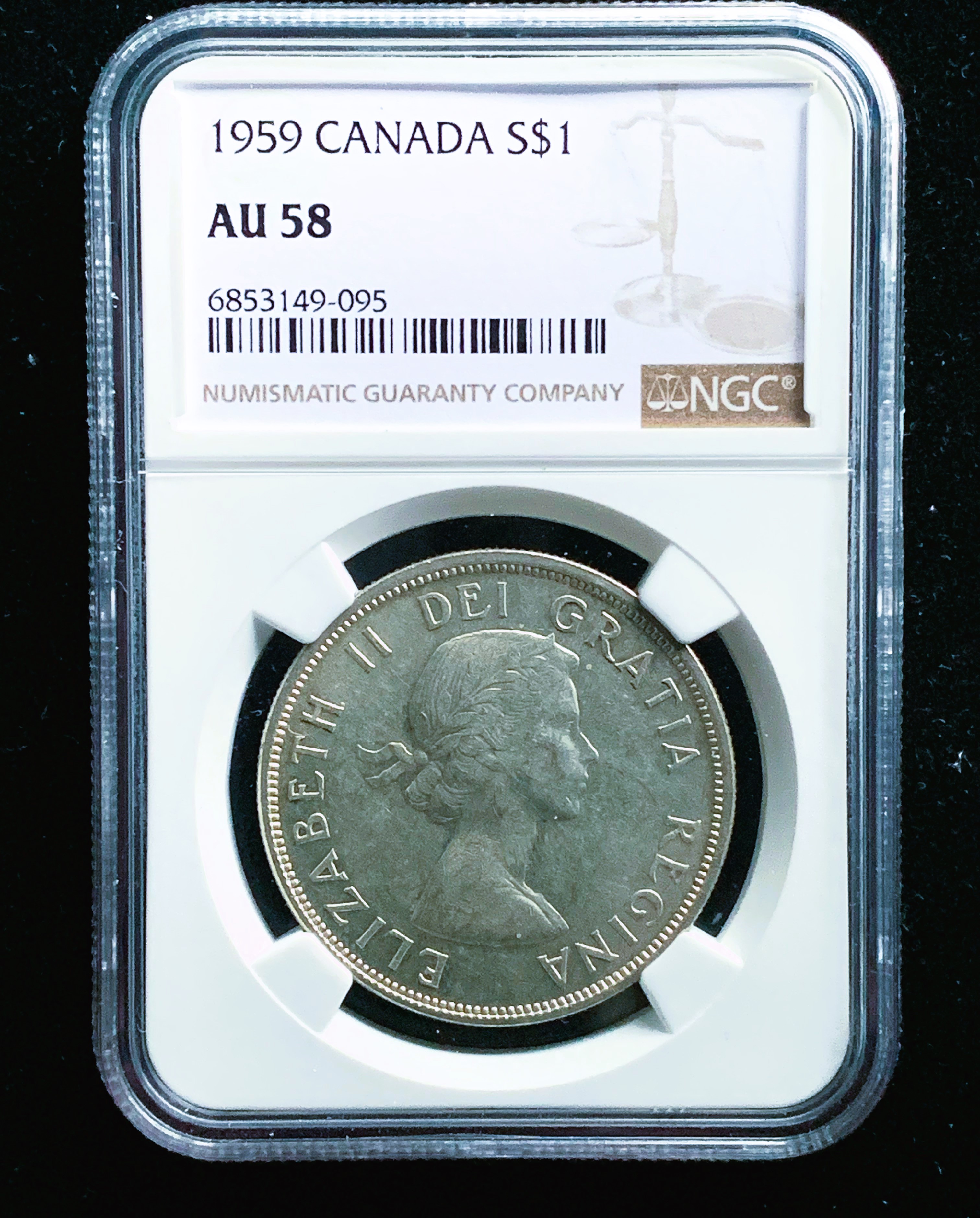 1959 SILVER CANADA $1 AU 58 NGC GRADED IN THE SLAB, SHINY DETAILED COIN | Property Room