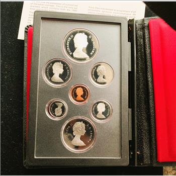 1983 DOUBLE DOLLAR , CANADA 7 COIN PROOF SET, 1 SILVER DOLLAR, ORIG CASE, BOOK, BOX | Property Room