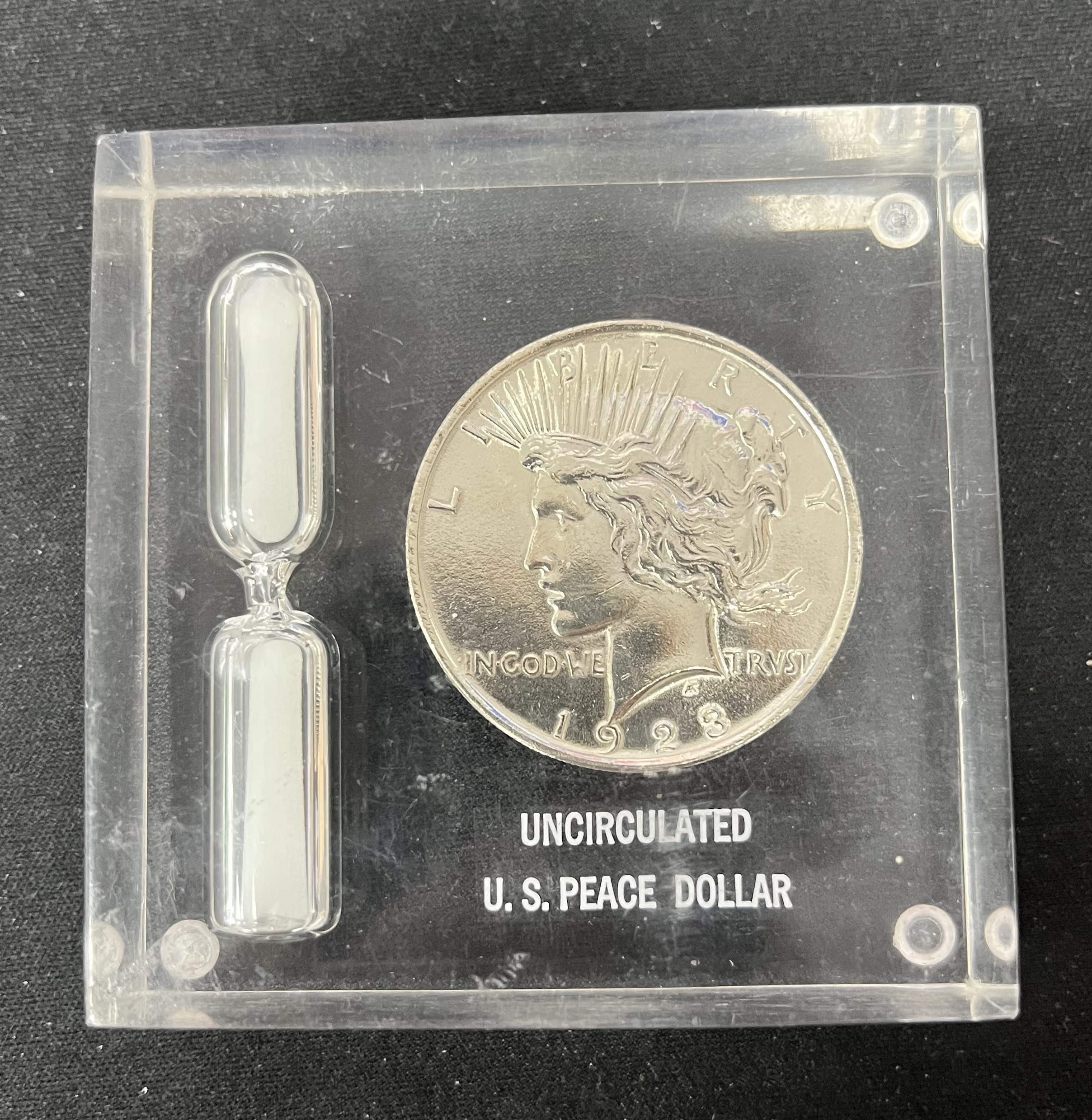 Lucite Peace Dollar Paperweight | Property Room